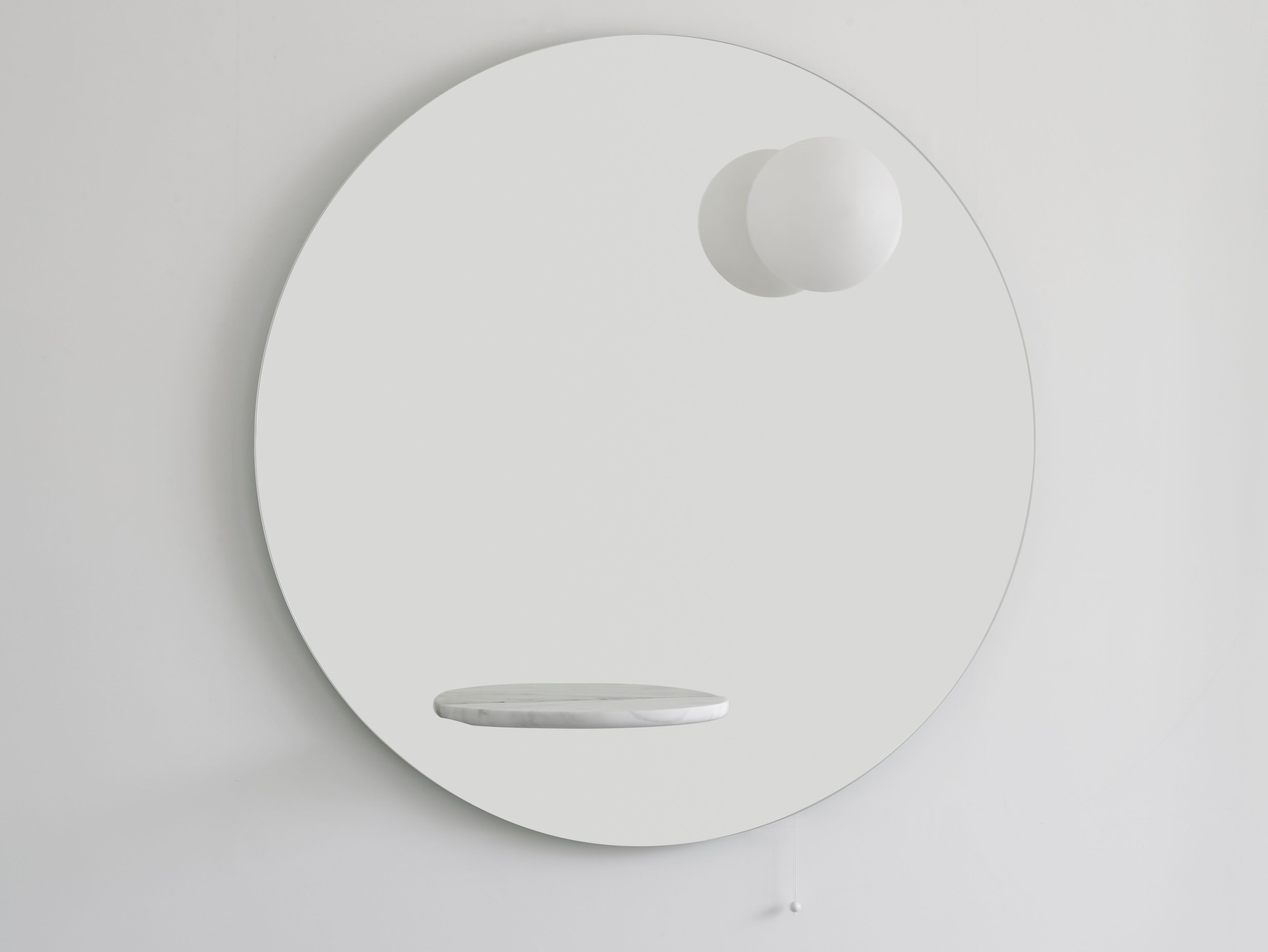 Round wall-mounted bathroom mirror FLOAT By Ex.t design Samuel Wilkinson