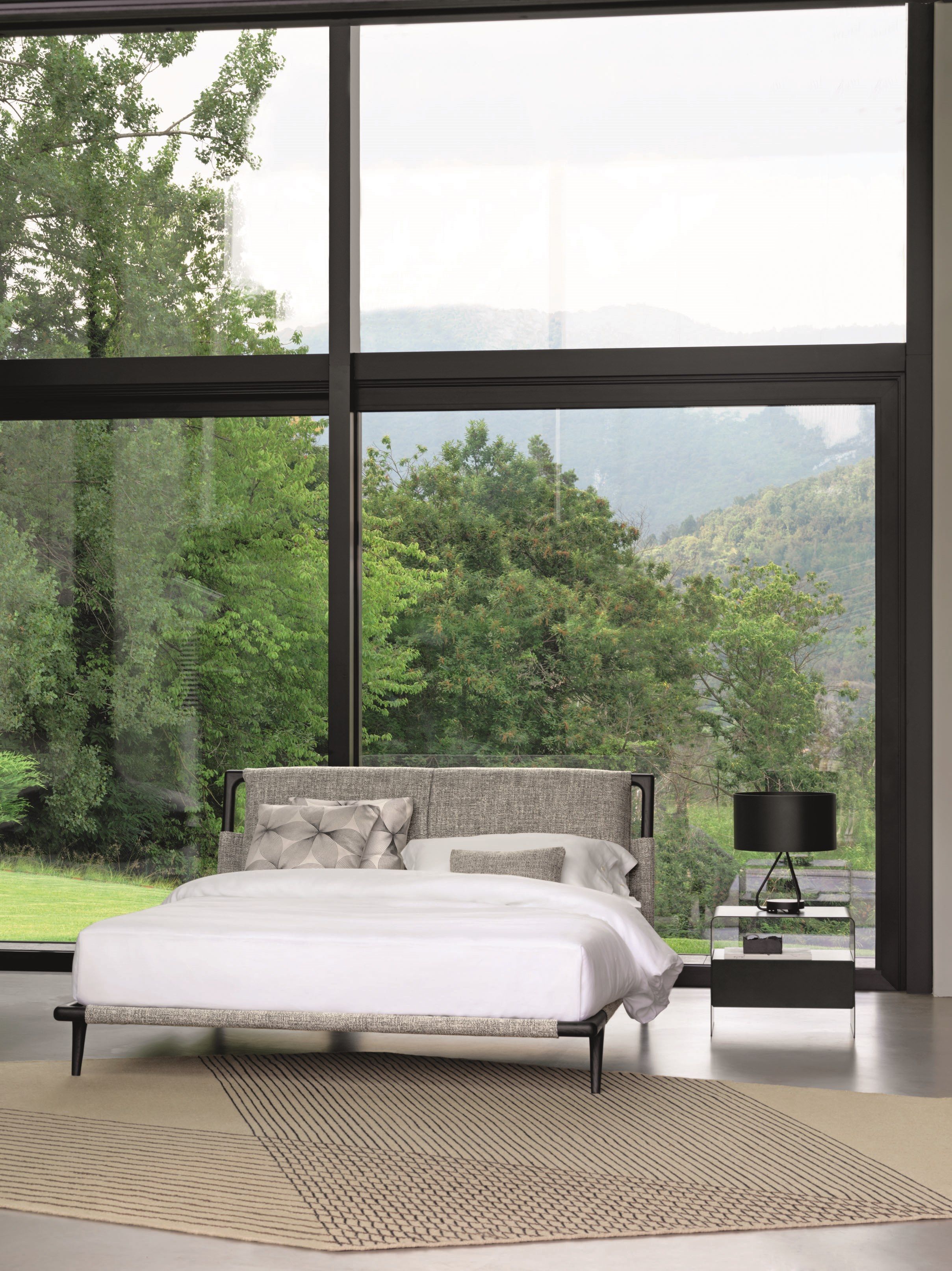 GAUDÍ Double bed with upholstered headboard By Flou