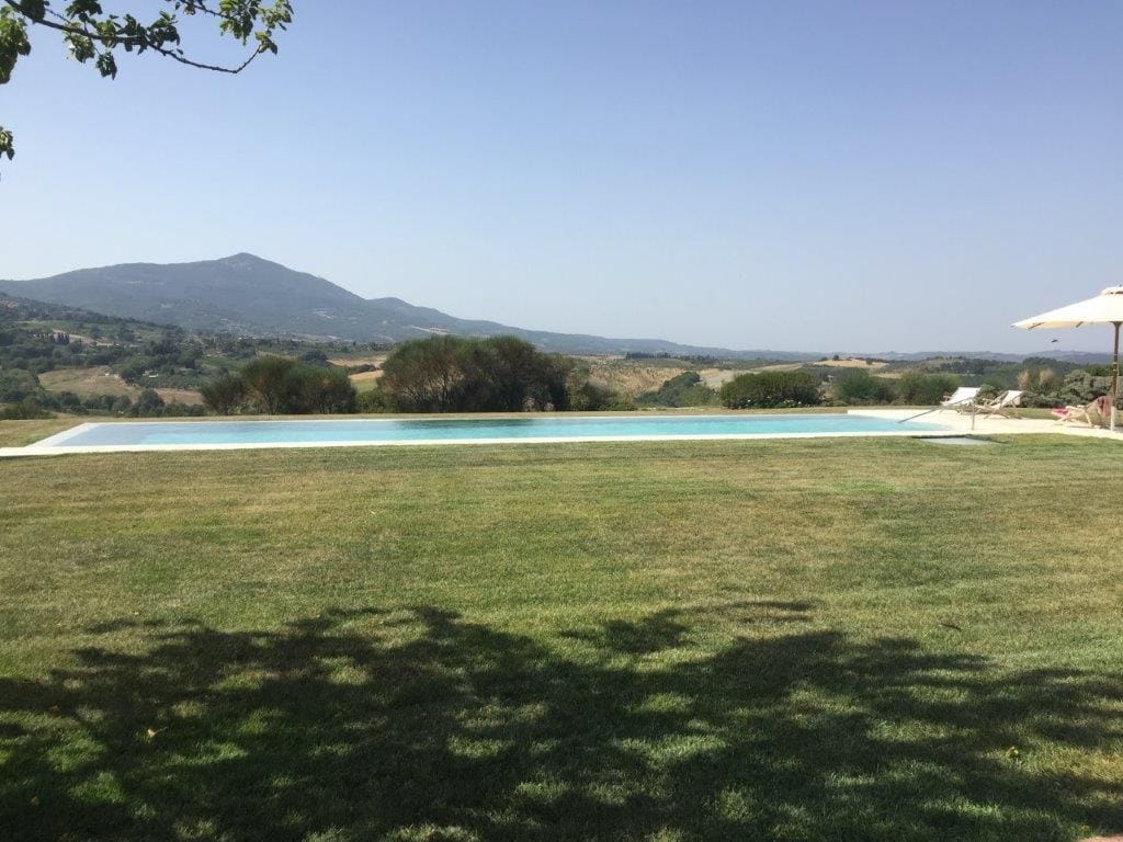 Infinity swimming pool Infinity travertine swimming pool with waterfall ...