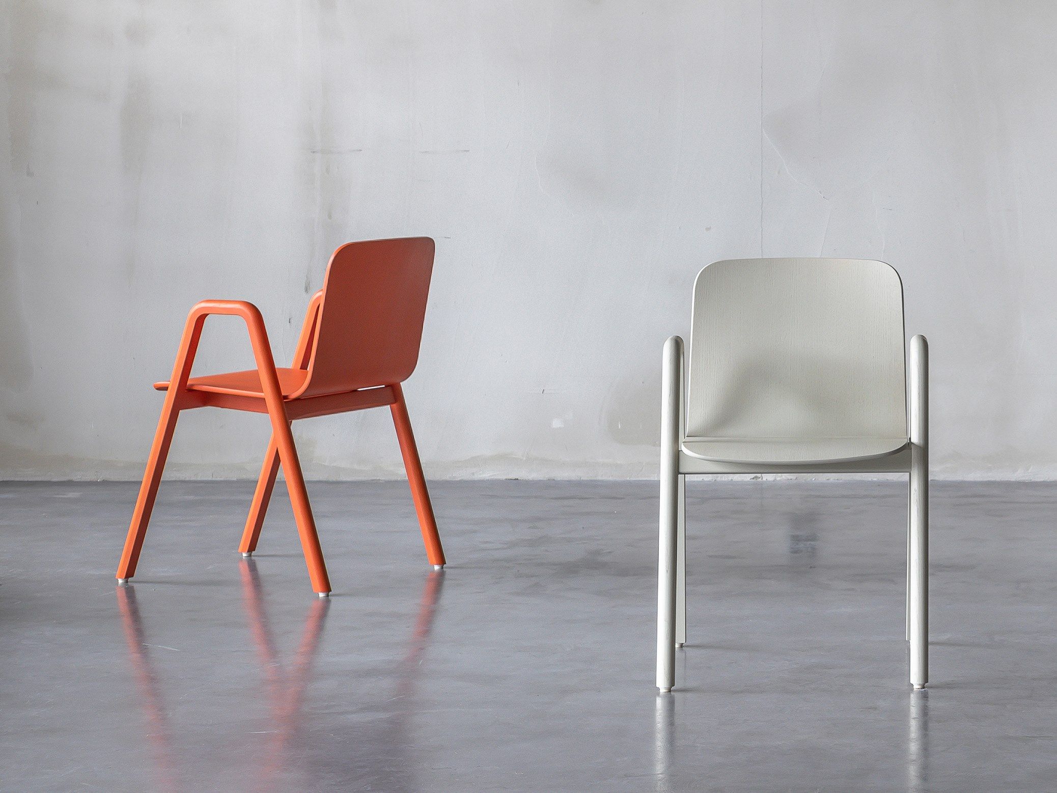 NAKU Stackable wooden chair with armrests By Inno | design Harri Korhonen