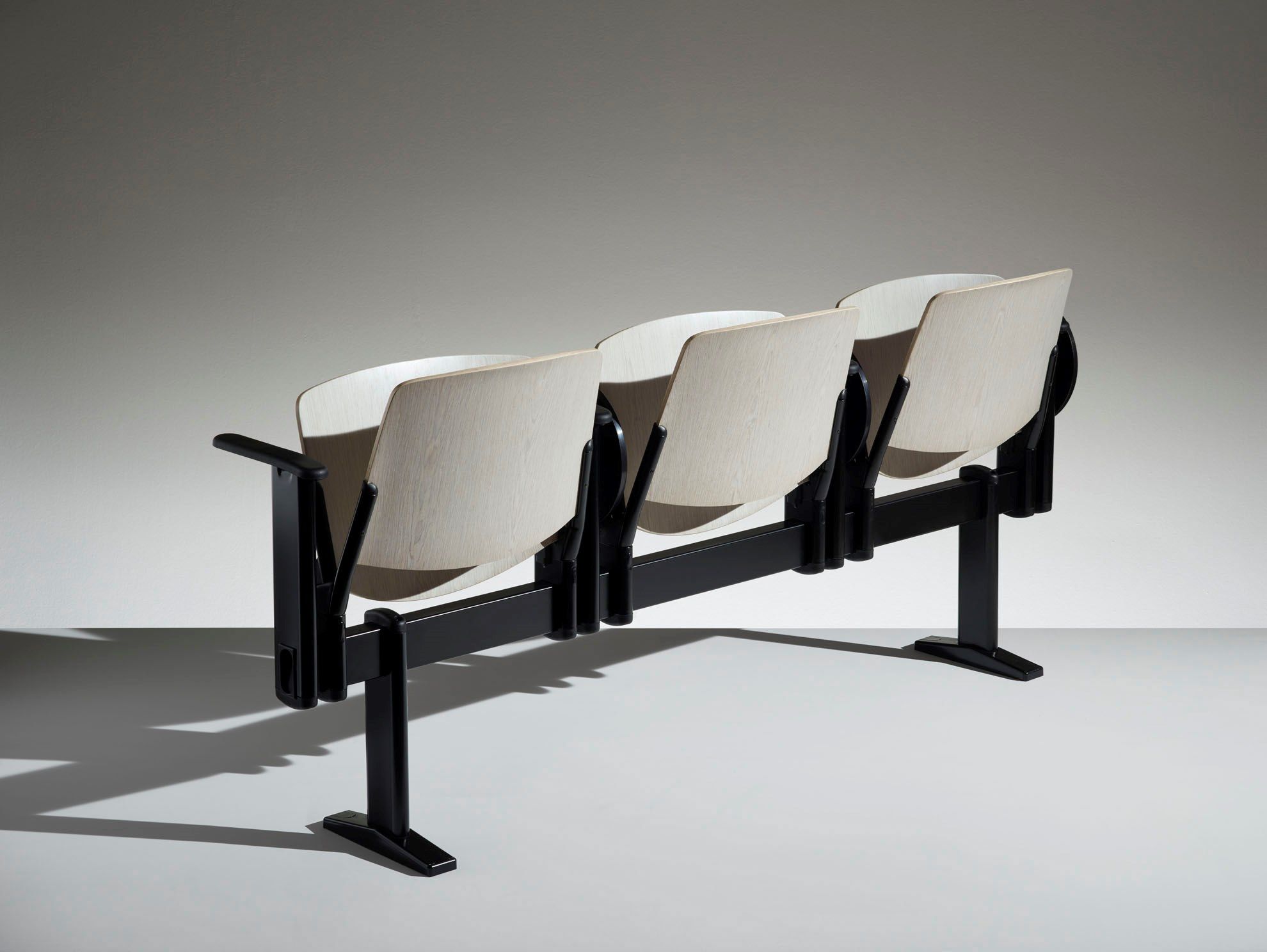 NEW MODULAMM | Beam seating with tip-up seats Wooden beam seating with armrests with writing ...