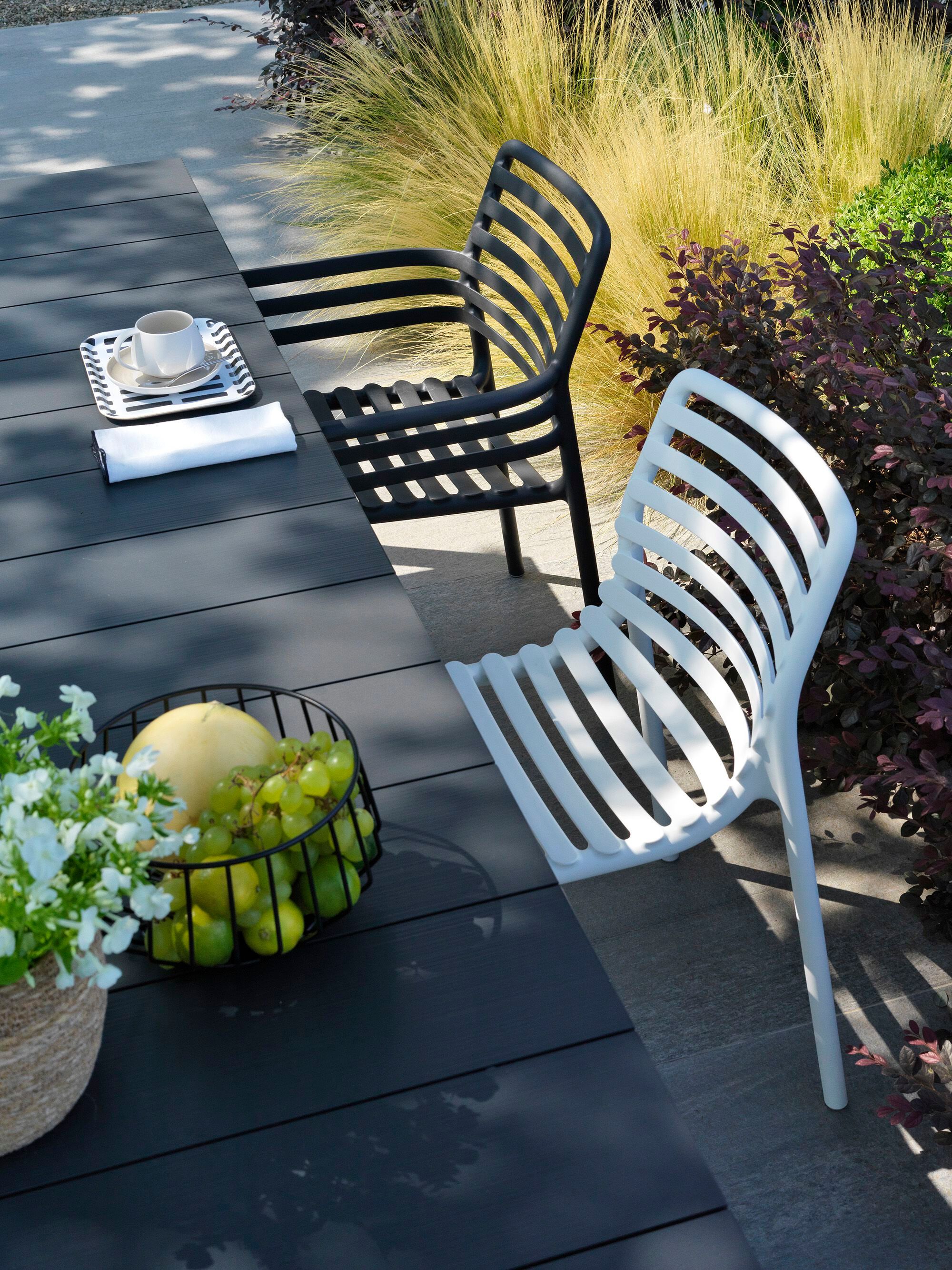 DOGA ARMCHAIR Stackable polypropylene chair with armrests By Nardi ...