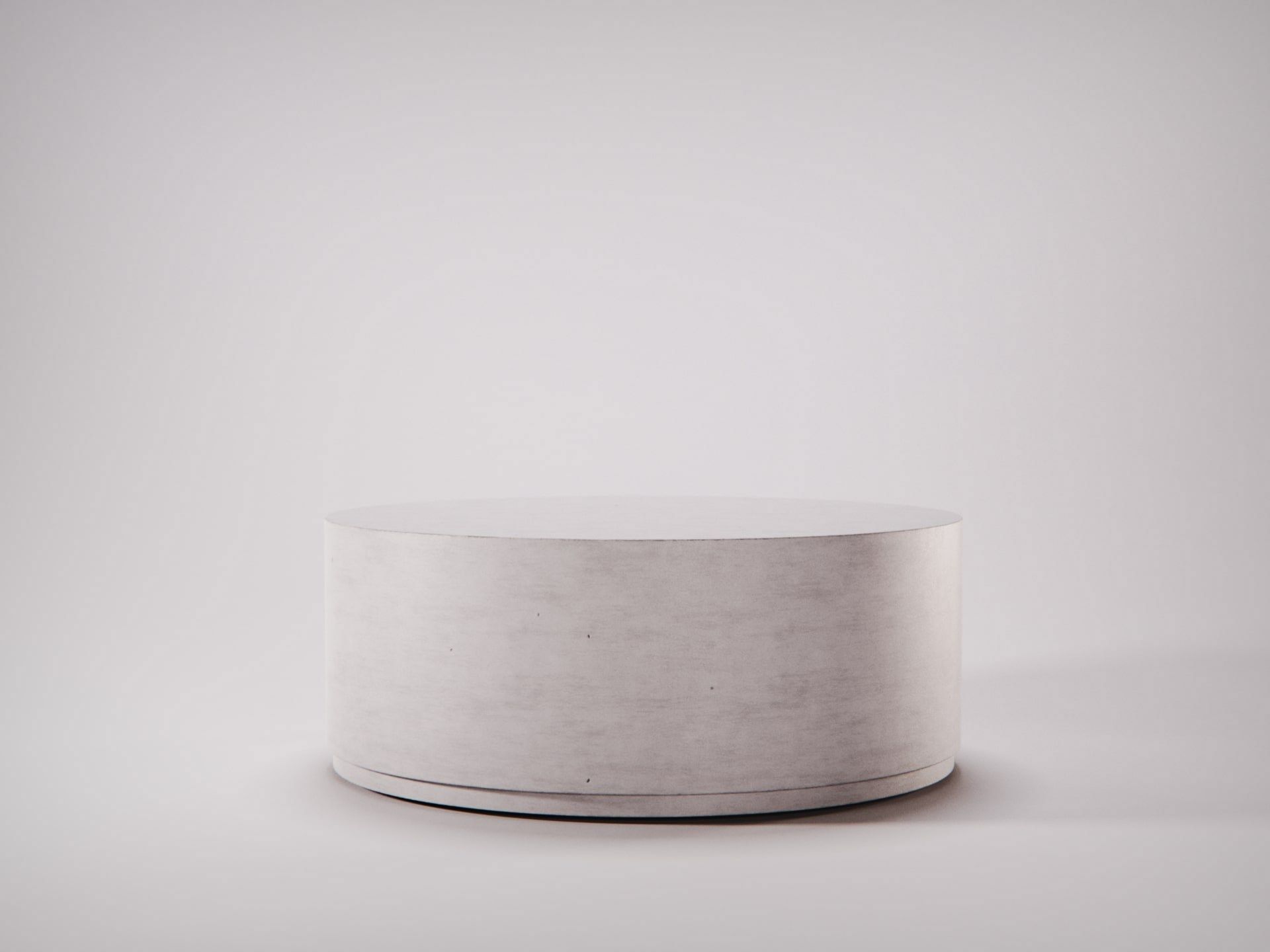 Low round cement coffee table PUCK By Forma&Cemento