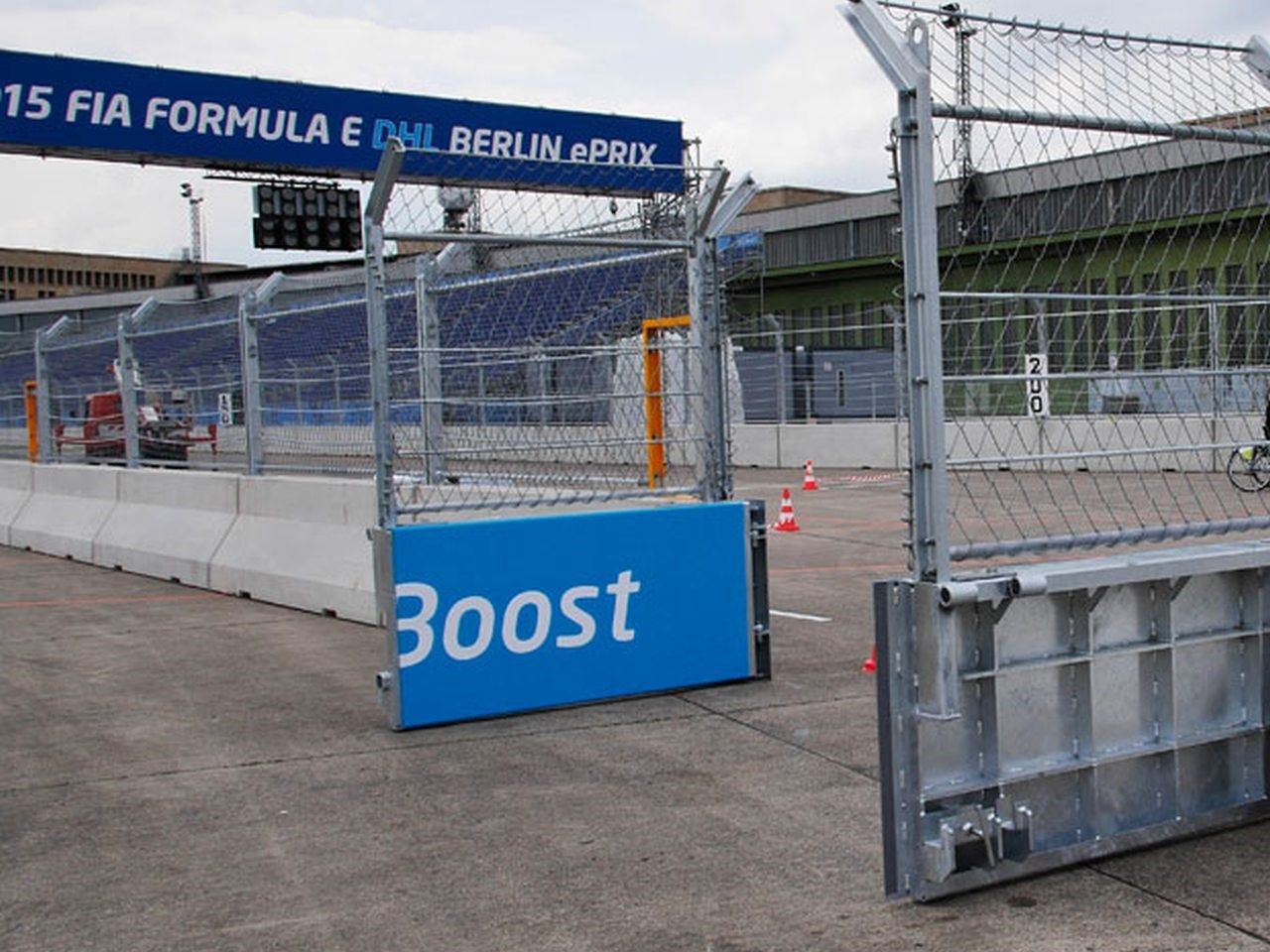 Pit wall gate Swing Motorized steel gate By GEOBRUGG