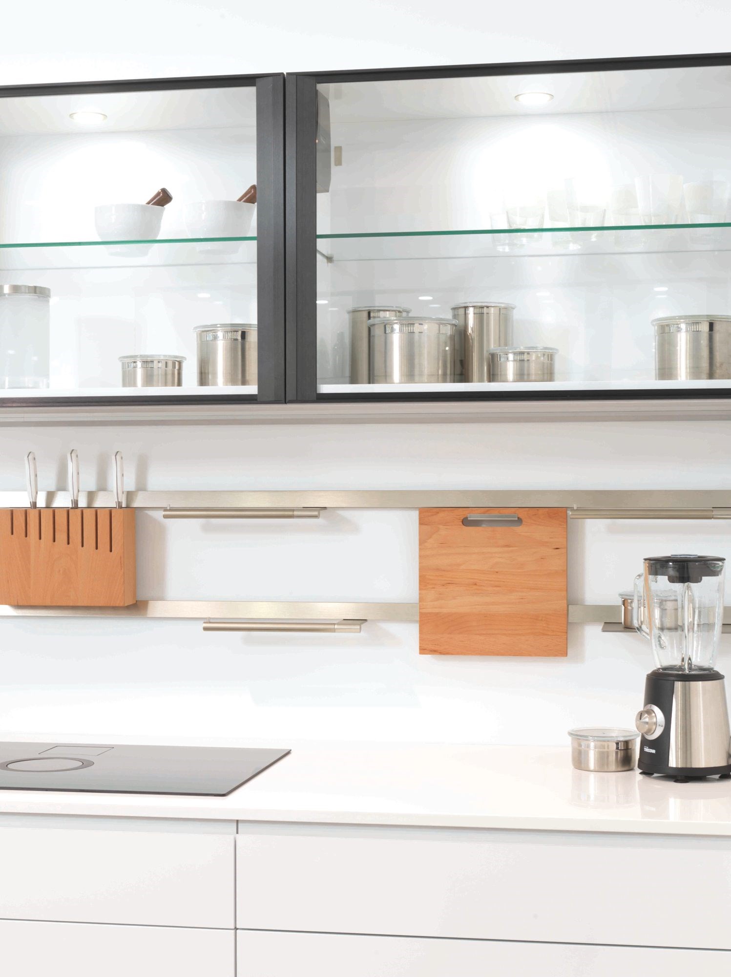 Contemporary style wood-product fitted kitchen with integrated handles ...