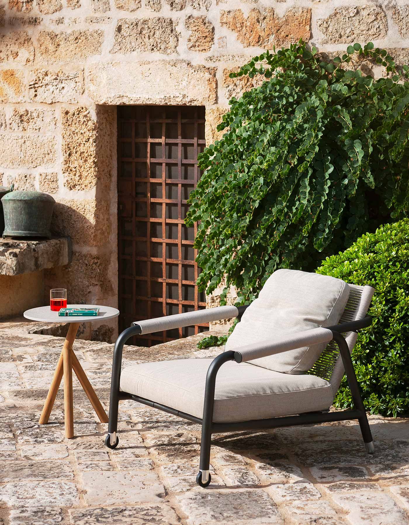 ASTRA Fabric garden armchair with armrests By RODA | design Rodolfo Dordoni