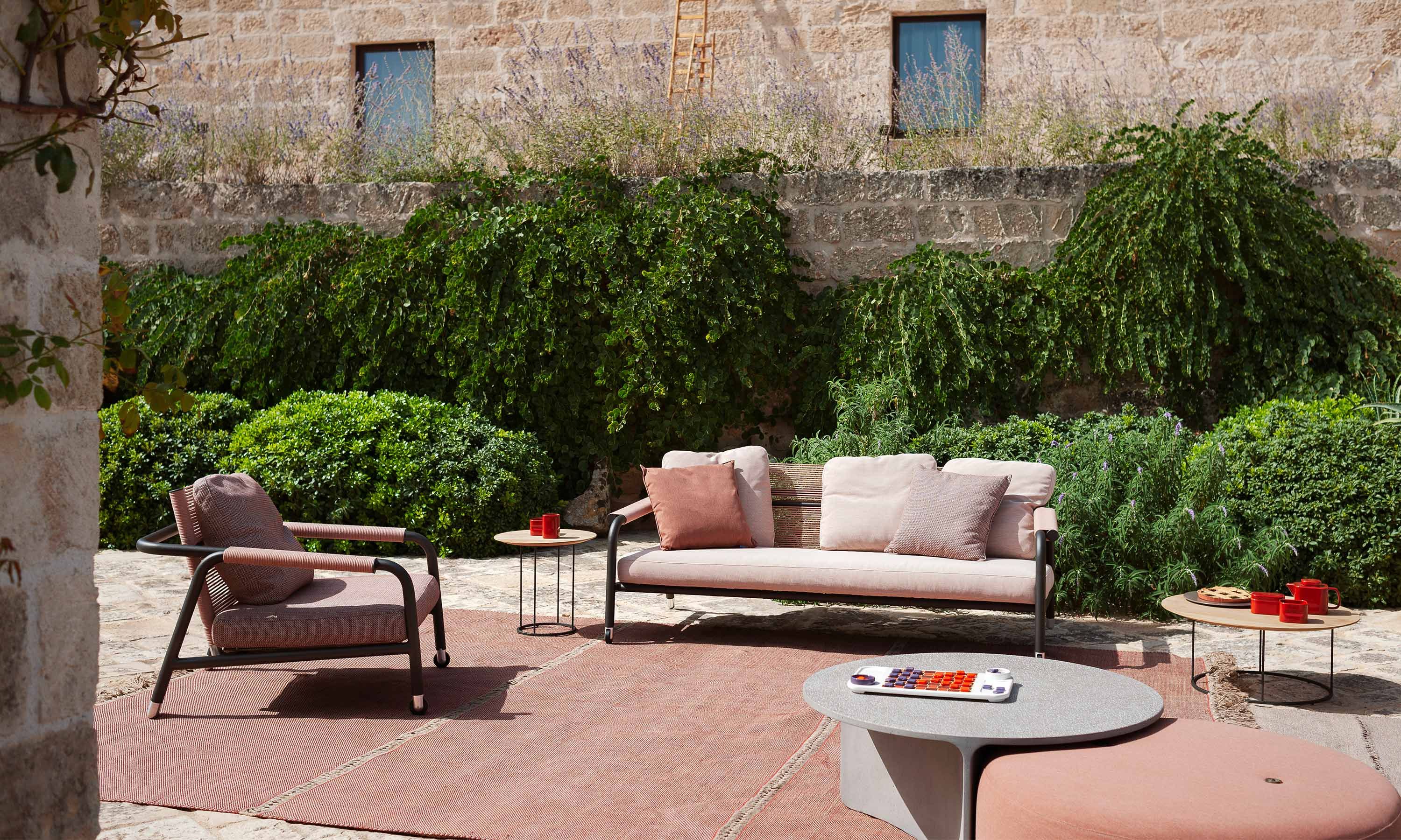 ASTRA Fabric garden armchair with armrests By RODA | design Rodolfo Dordoni