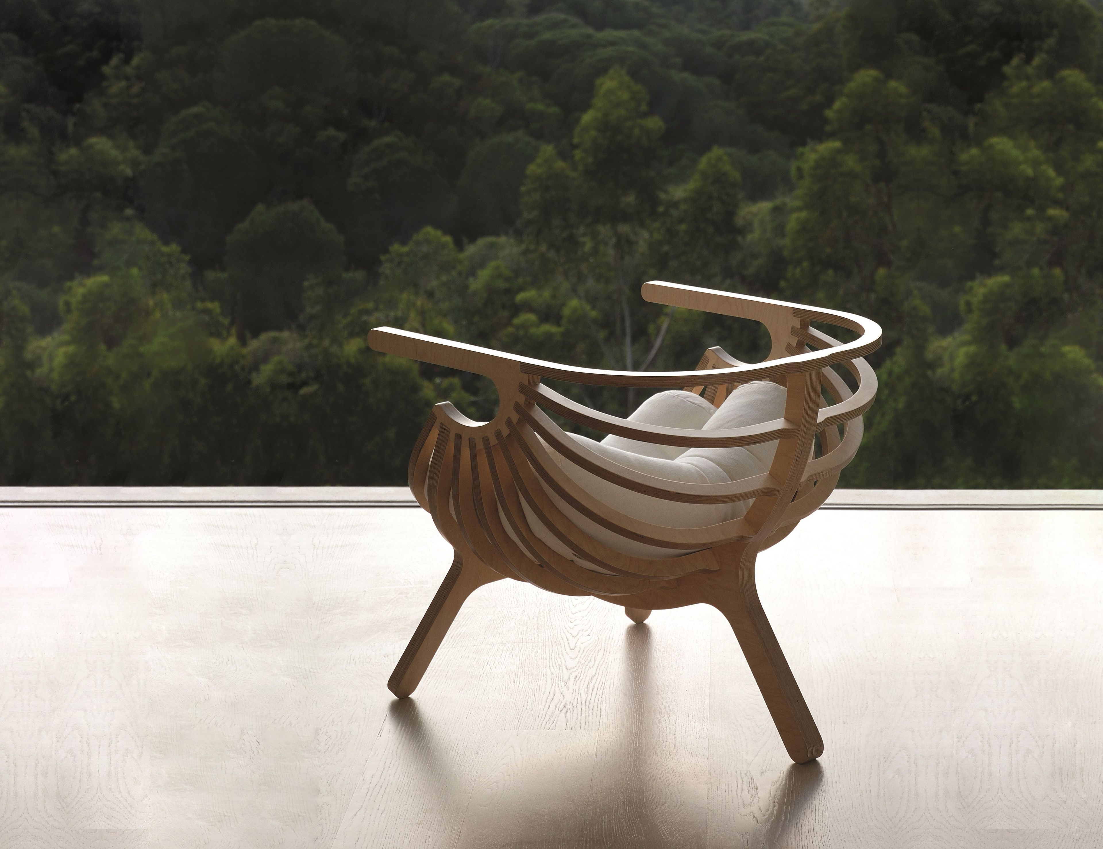 SHELL CHAIR Multi-layer wood easy chair with armrests By Branca Lisboa