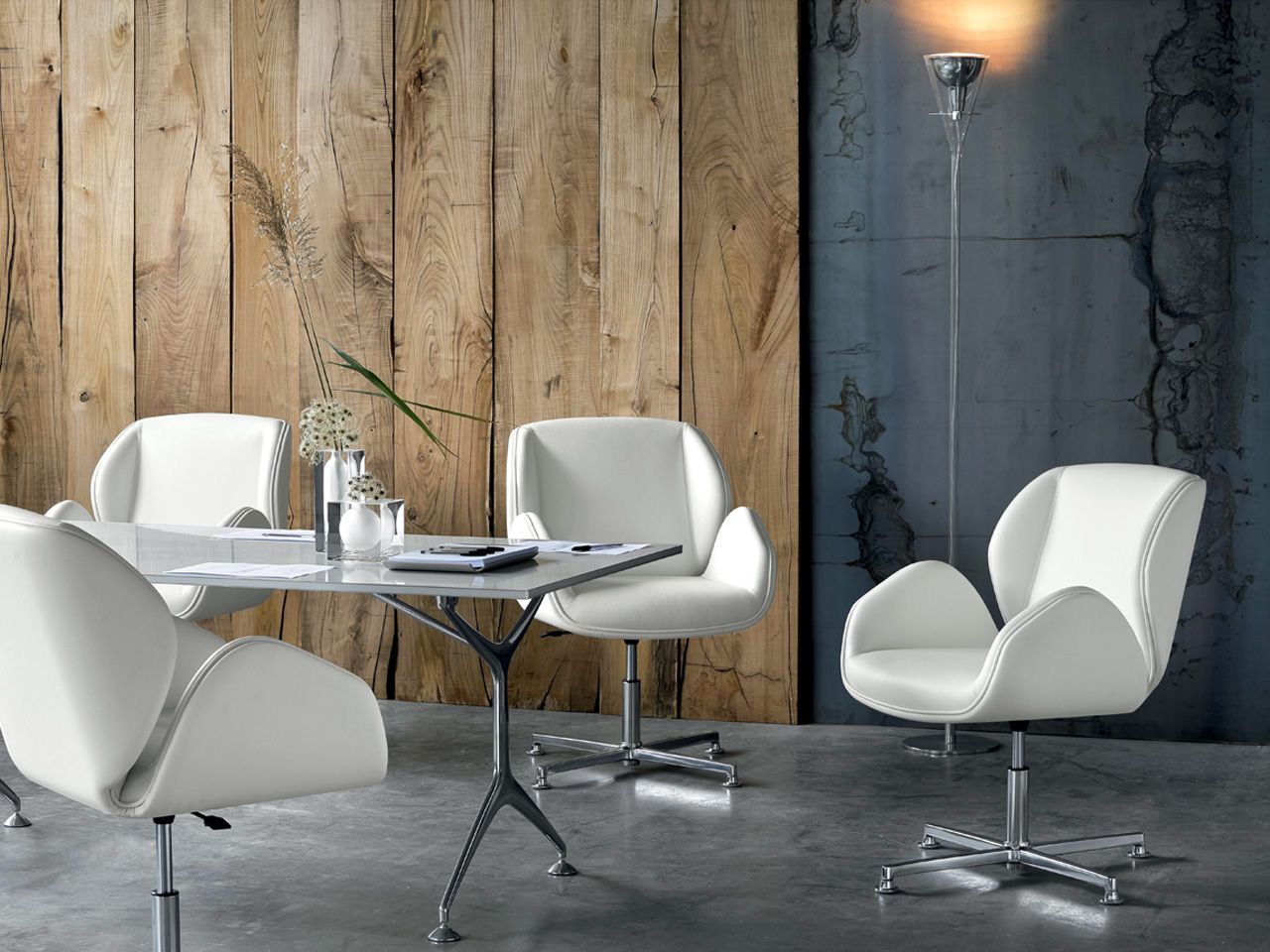 SUONI GUEST Swivel upholstered easy chair with castors By VAGHI