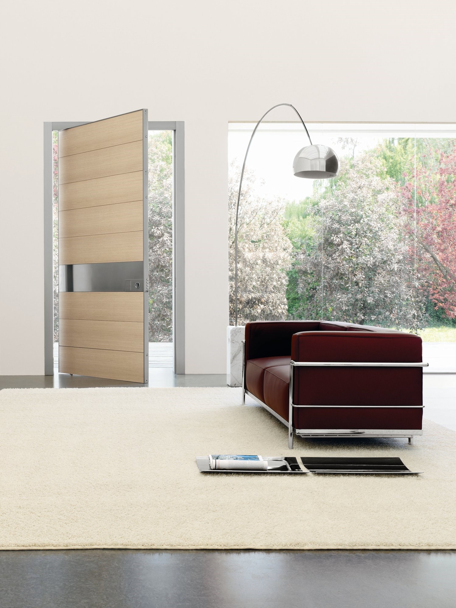 SYNUA Pivot wooden safety door By OIKOS VENEZIA