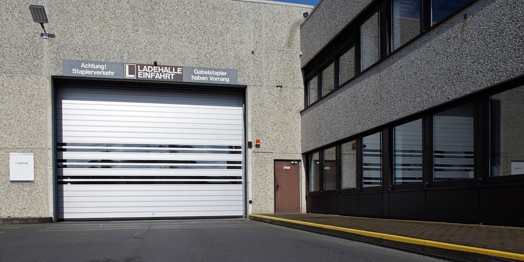 Slatted exterior doors Sectional door By ASSA ABLOY Entrance Systems