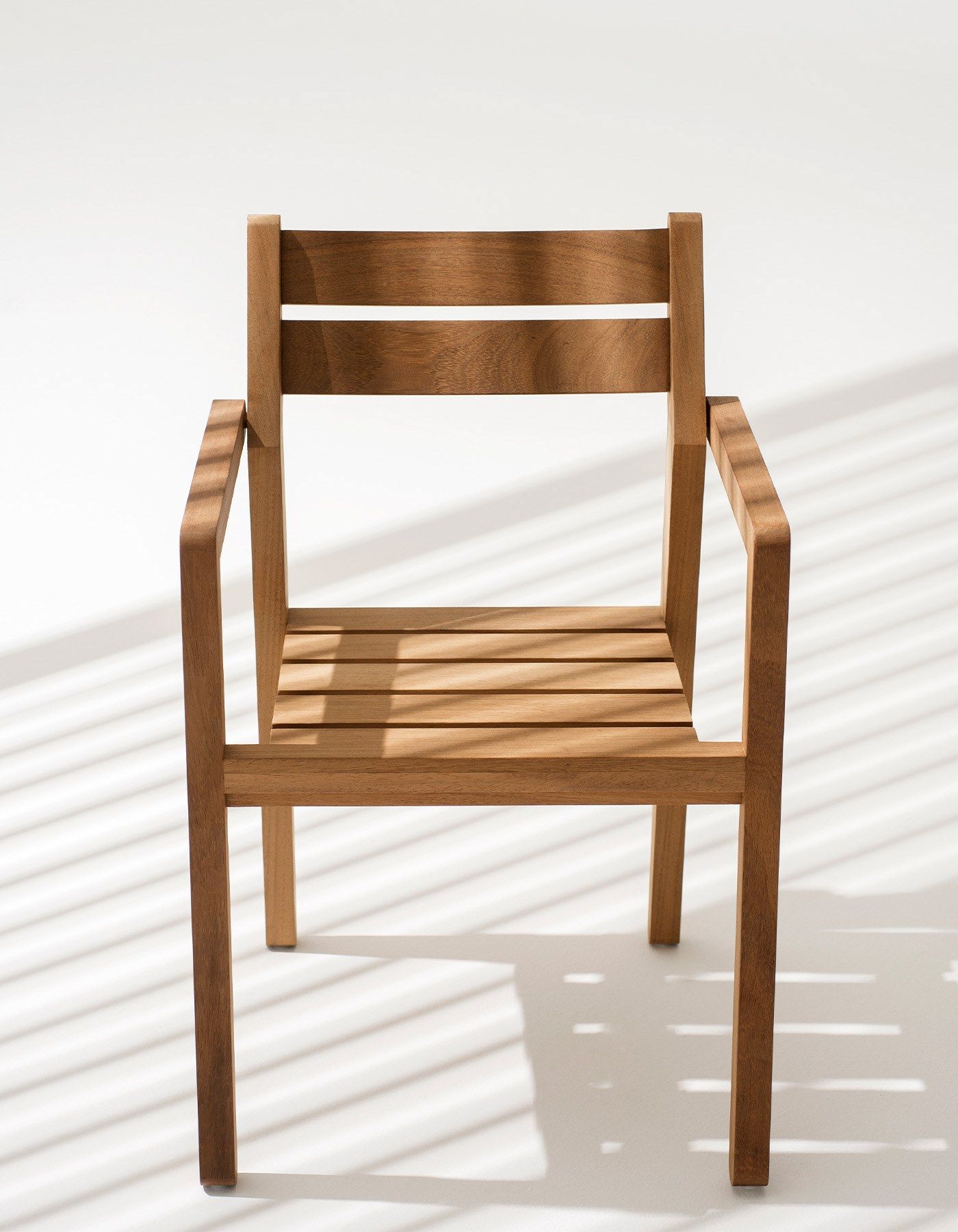 ZANIA Stackable iroko garden chair with armrests By RODA
