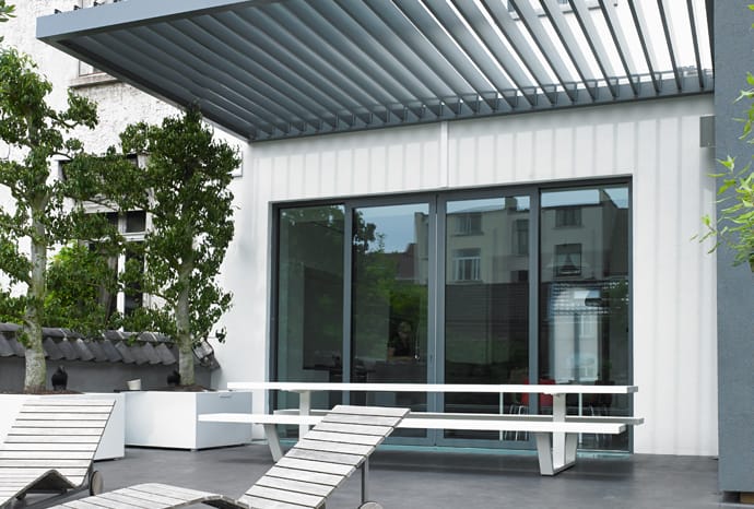 Motorized pergola with adjustable louvers AERO® By RENSON