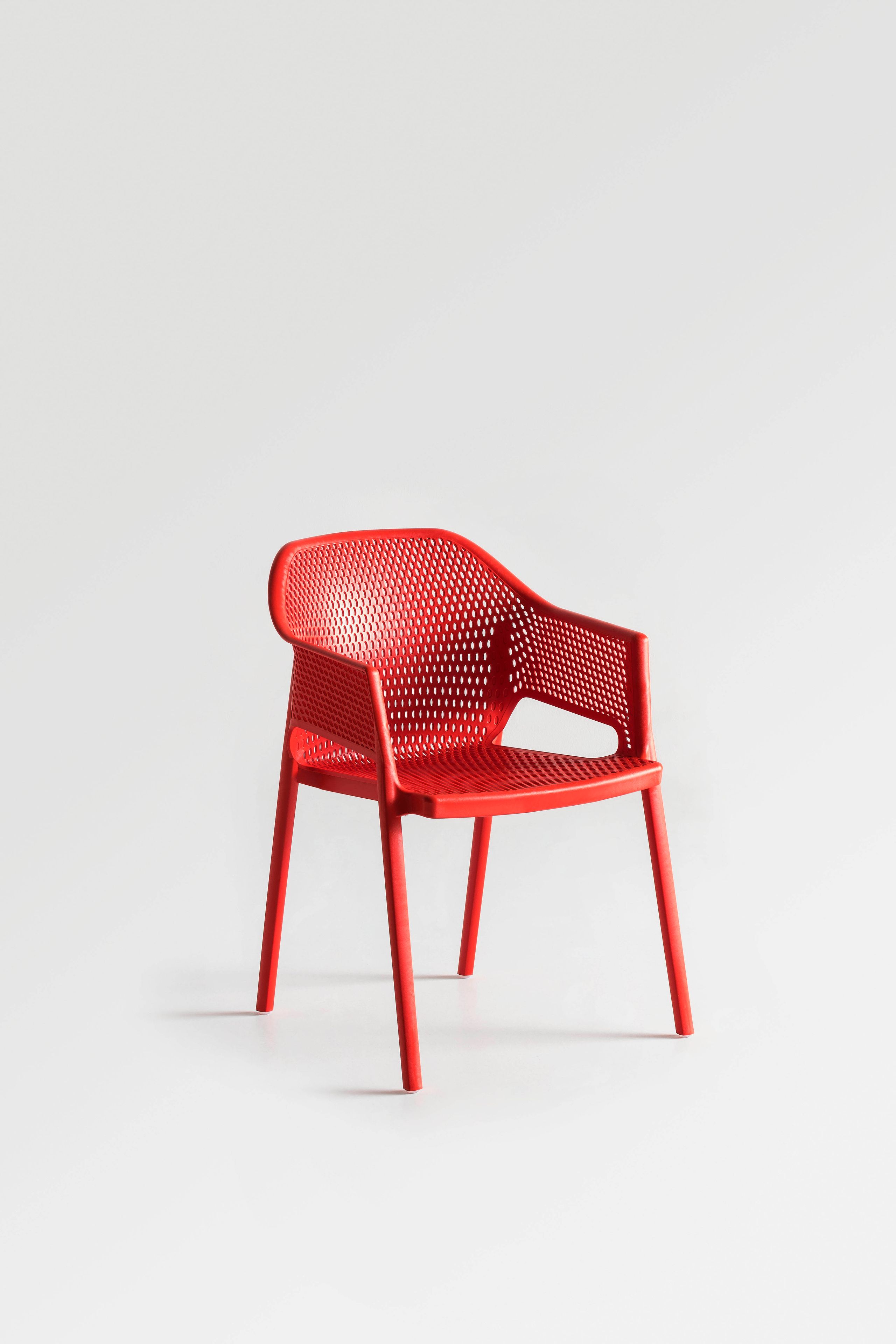 MINUSH Stackable technopolymer chair with armrests By GABER | design Eurolinea